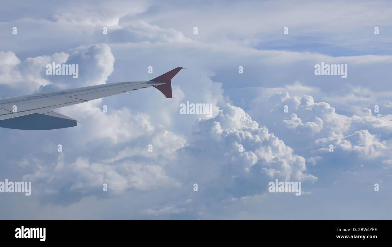 Storm clouds and part of the wing of the aircraft window Stock Photo ...