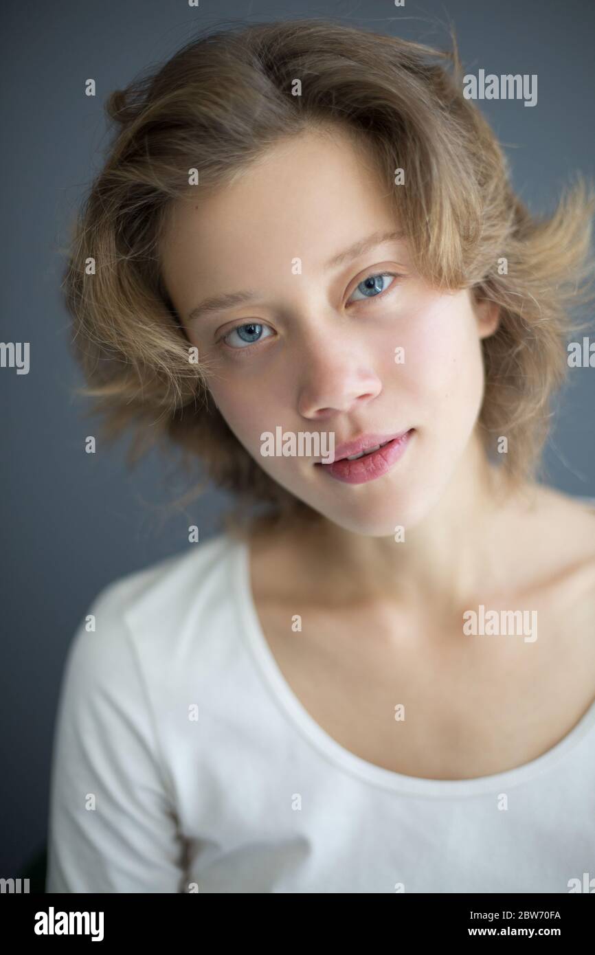Portrait of beautiful woman thoughtfully looking in camera Stock Photo ...