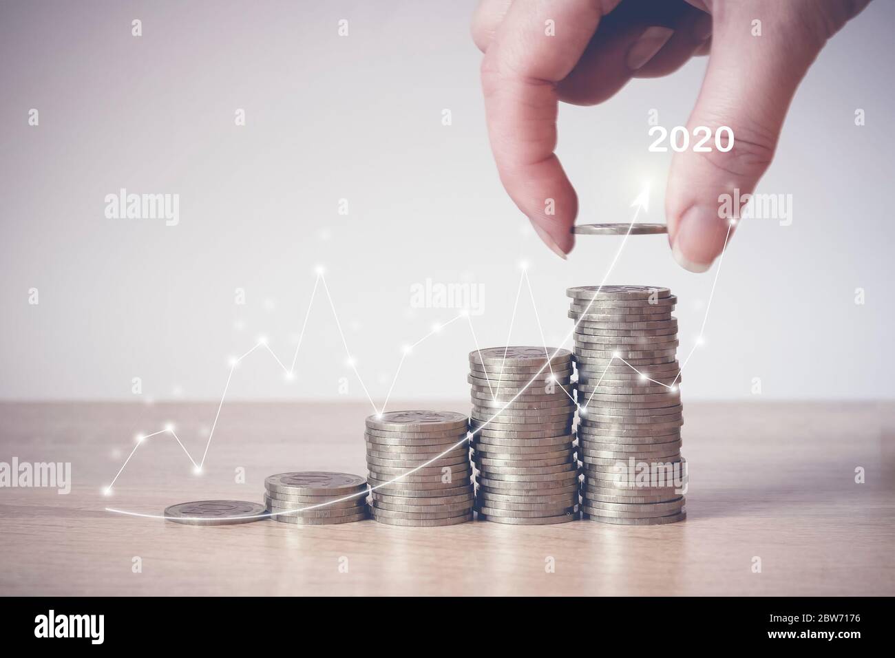 Hand putting money coin on line rising, virtual hologram statistics ...