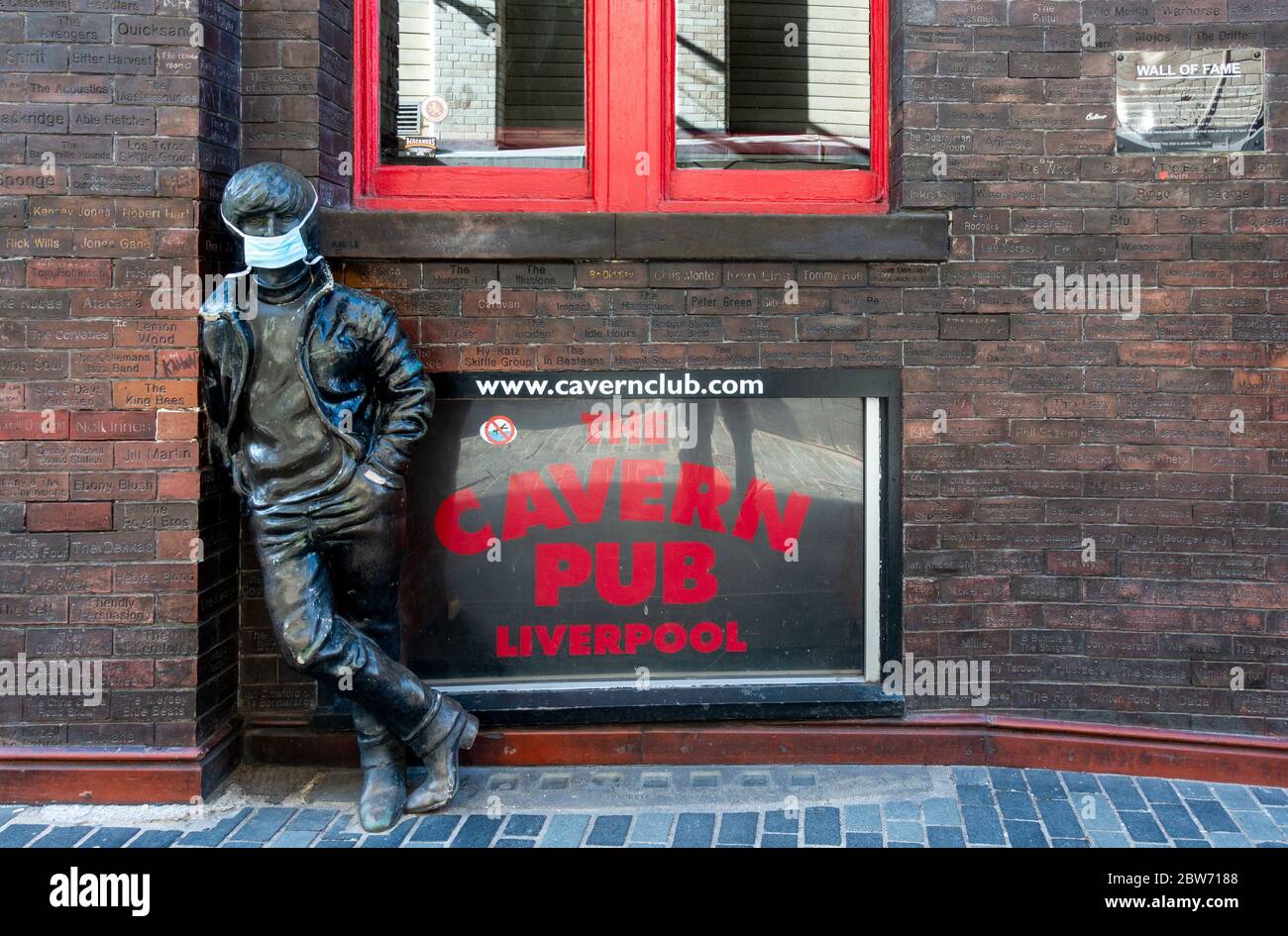John Lennon statue on Mathew Street in Liverpool wearing an antivirus ...