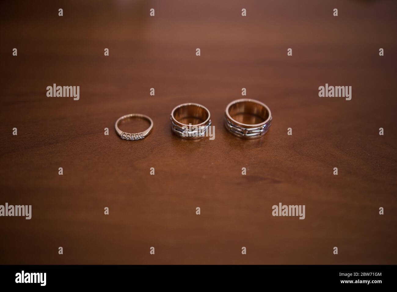 a wedding rings on table Stock Photo - Alamy