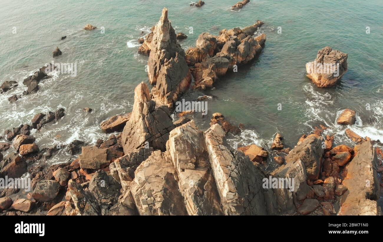 Aerial view rocks and stones on the Arambol beach in North Goa, India ...