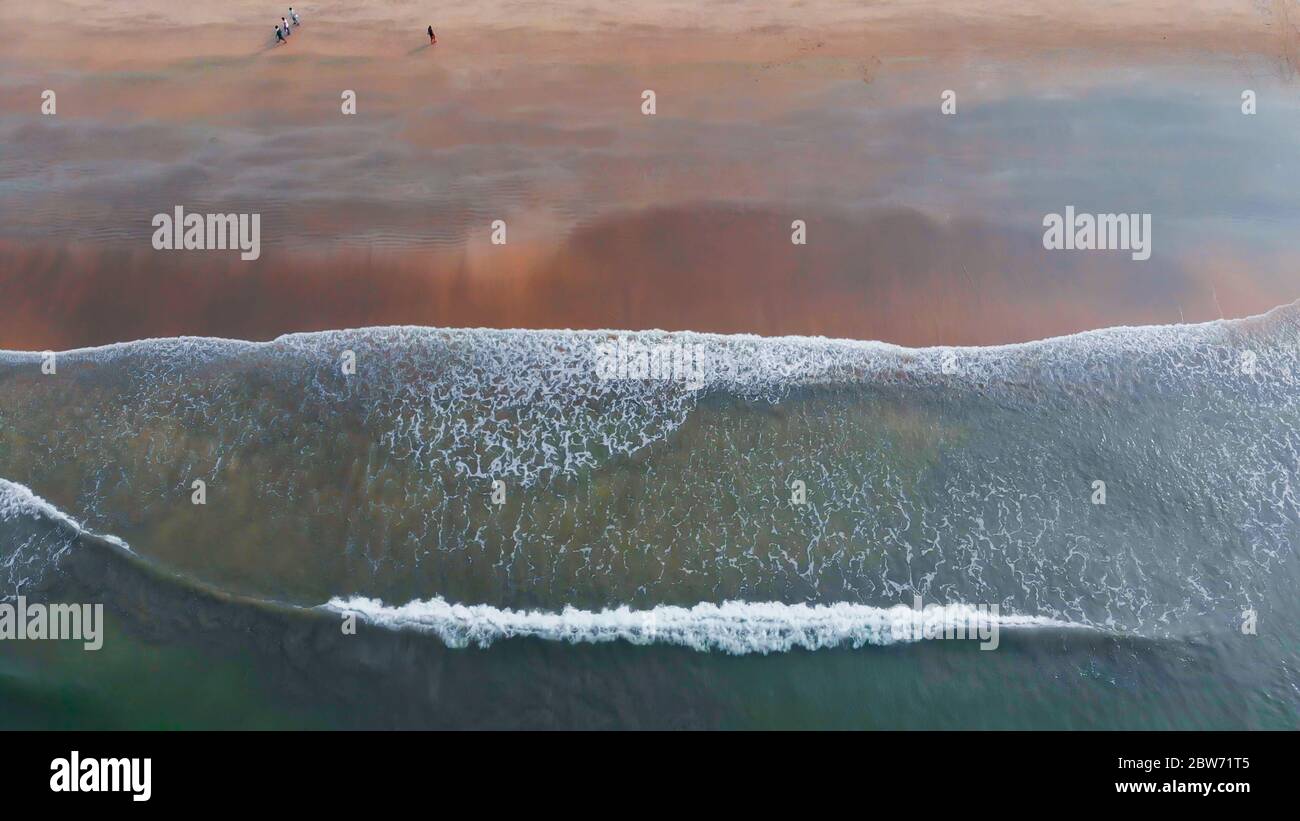 Shooting from the drone of the Arambol beach with tidal waves. Goa ...
