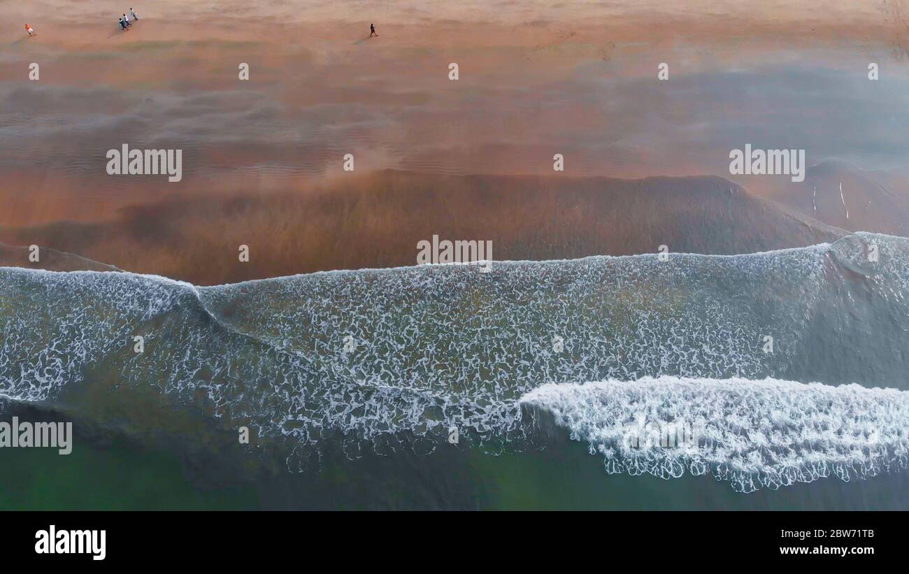 Shooting from the drone of the Arambol beach with tidal waves. Goa ...
