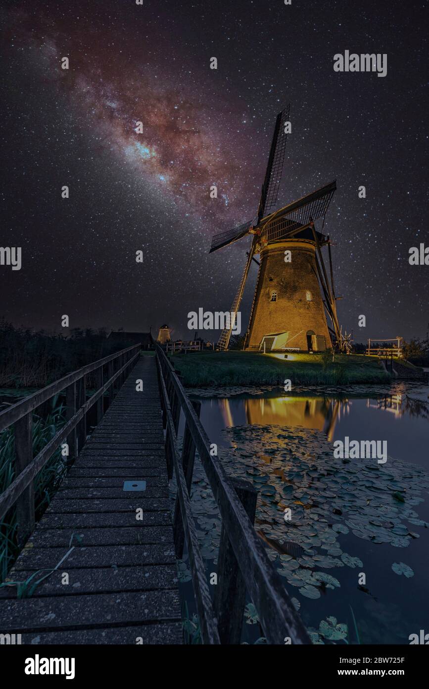 Milky way on the windmill servicing its duty under a warm cloudless and warm weather at ...