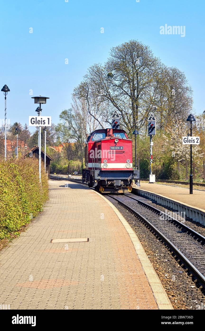 Old red diesel locomotive on a two track train station Stock Photo - Alamy