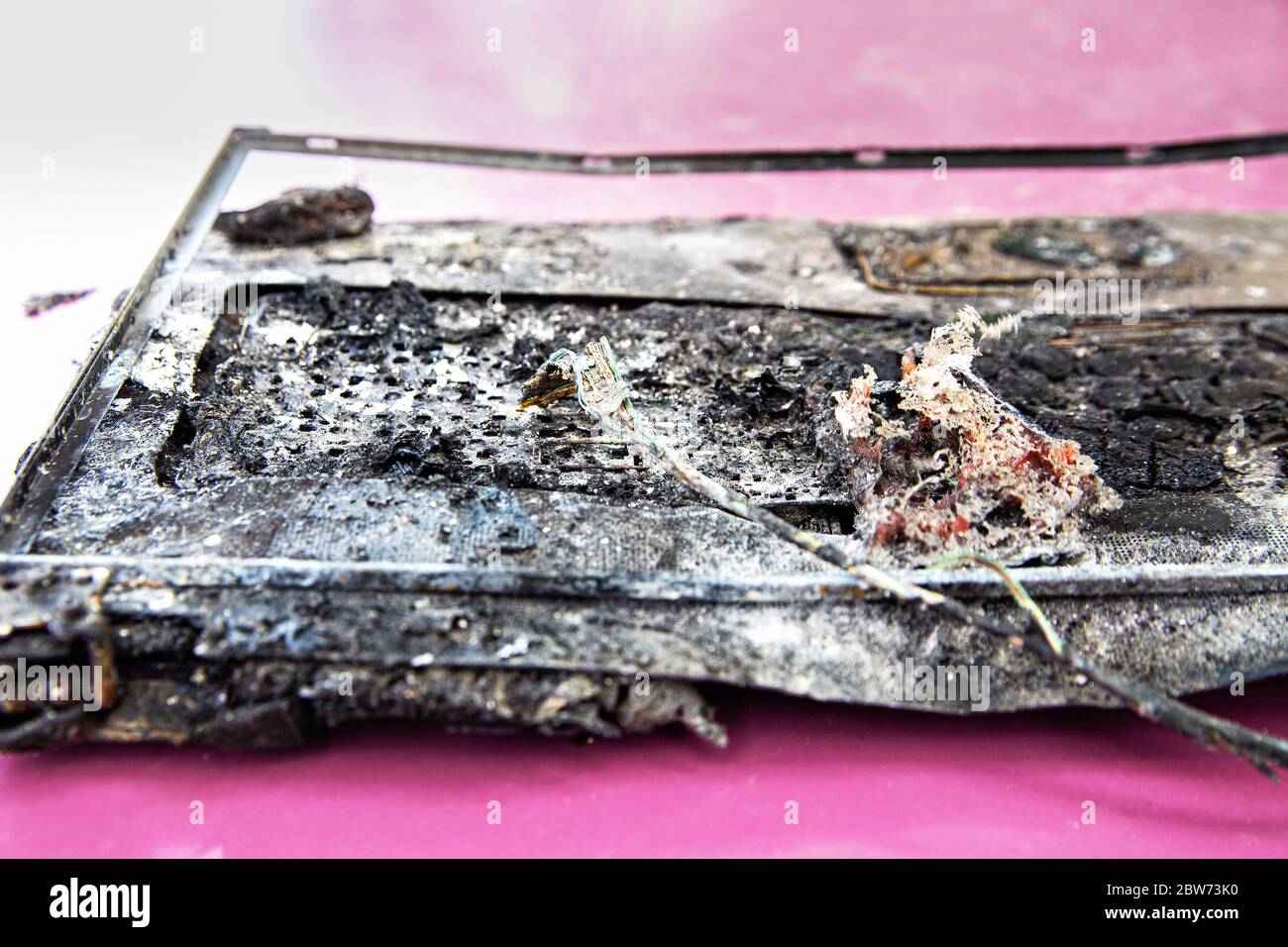 Computer Fire. Broken laptop computer spoiled by flame of hot fire ...