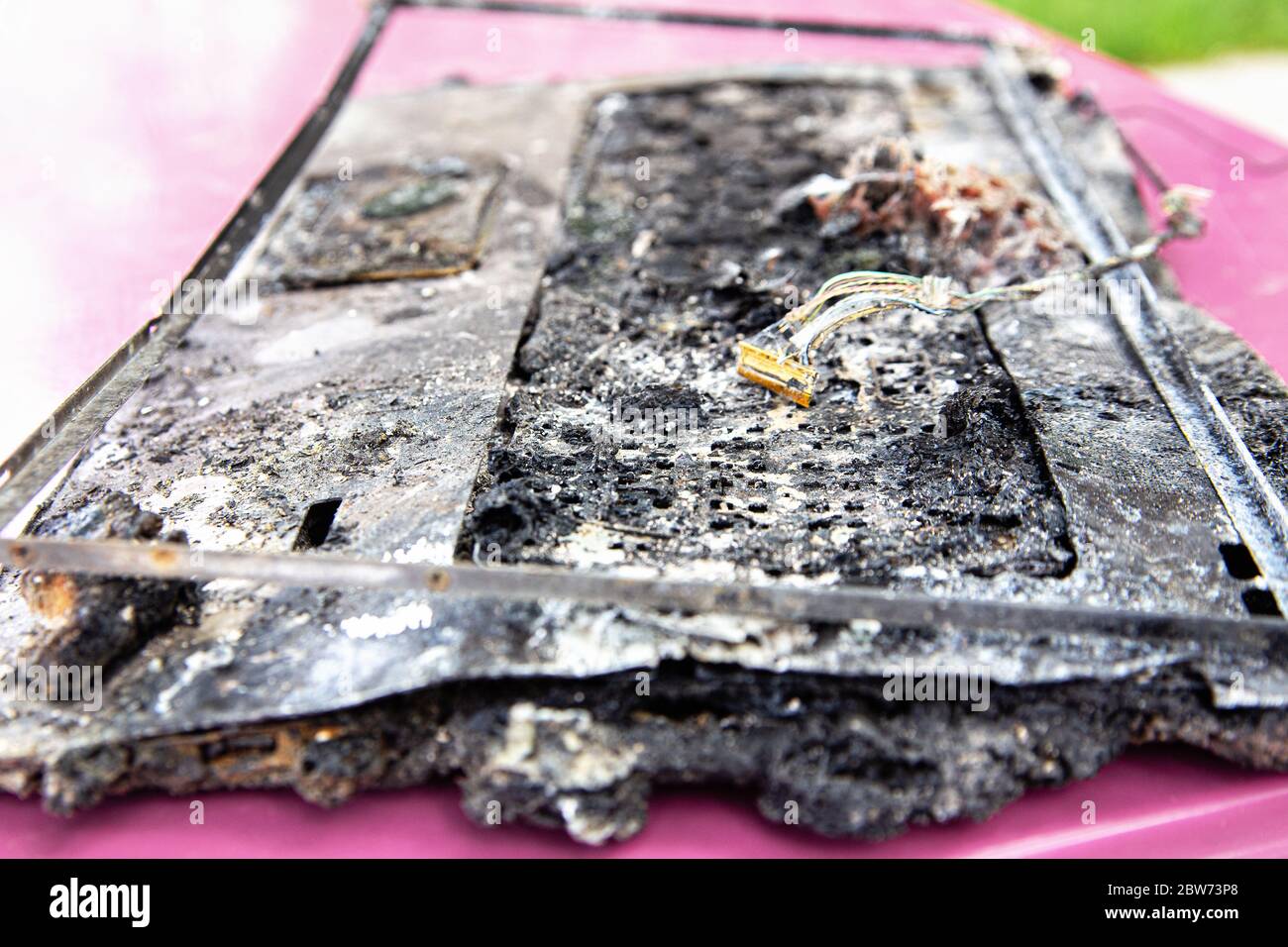 Computer Fire. Broken laptop computer spoiled by flame of hot fire ...