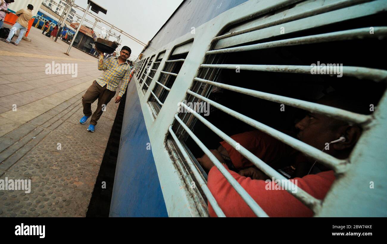 Agra, India - December 12, 2018: Lattice window of an Indian train at a ...