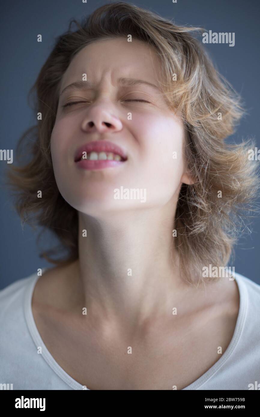 Portrait of young exhausted lady tiredly closing her eyes Stock Photo ...