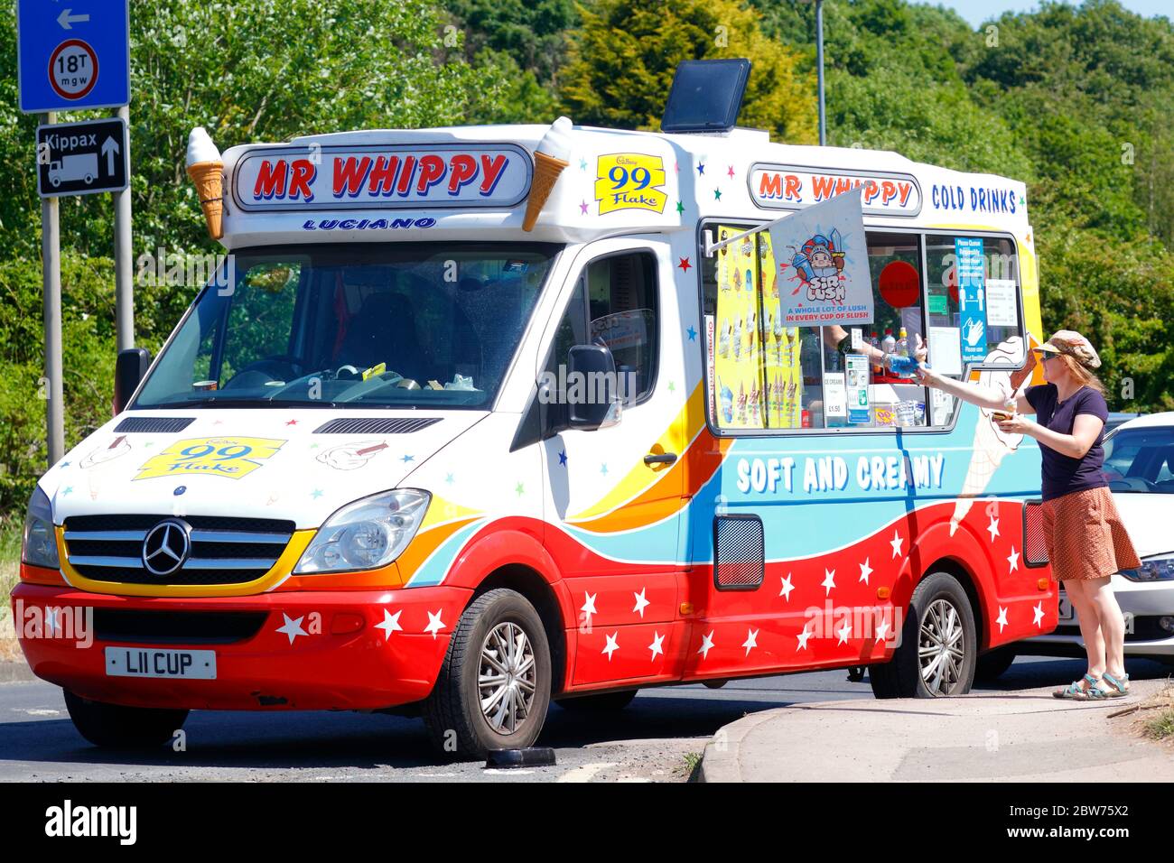 Buying an ice cream from an Ice Cream Van outside St Aidan's Nature ...