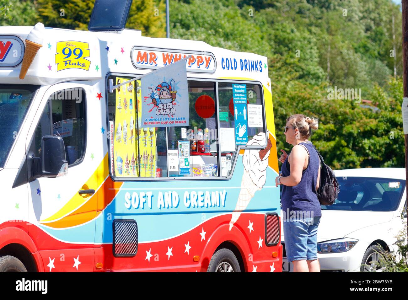 Buying an ice cream from an Ice Cream Van outside St Aidan's Nature ...