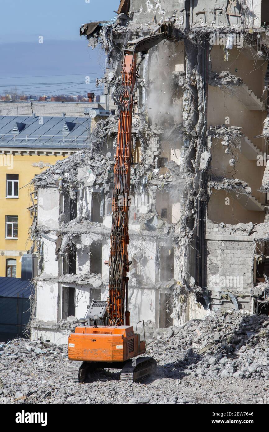 Demolition of building with excavator-destroyer for high-altitude work ...