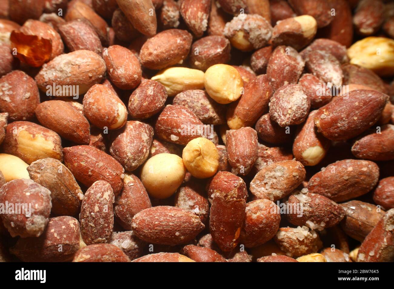 salted roasted peanuts in market, macro close up Stock Photo - Alamy