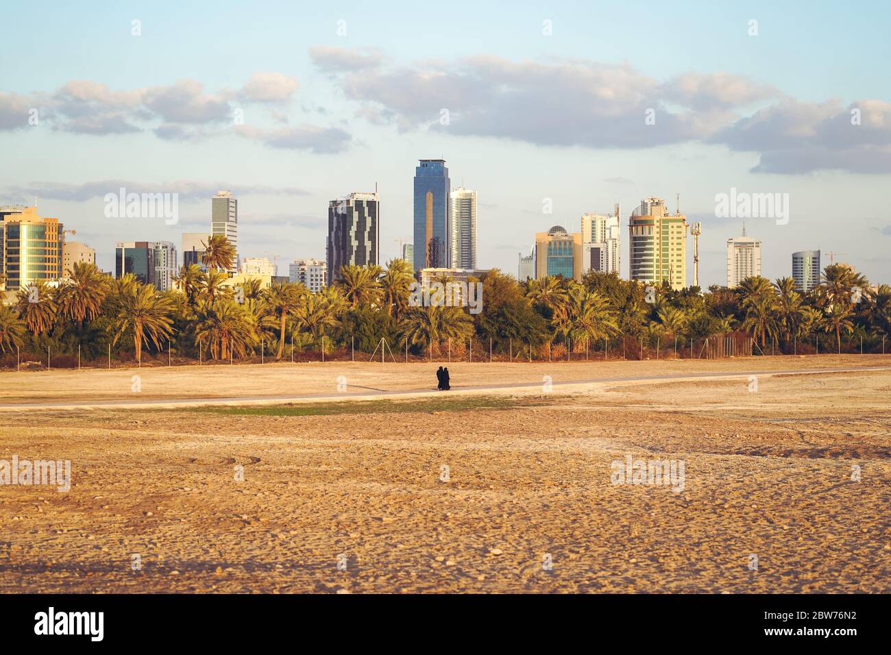 Cityscape of Bahrain with Muslim women wearing balck abaya niqab ...