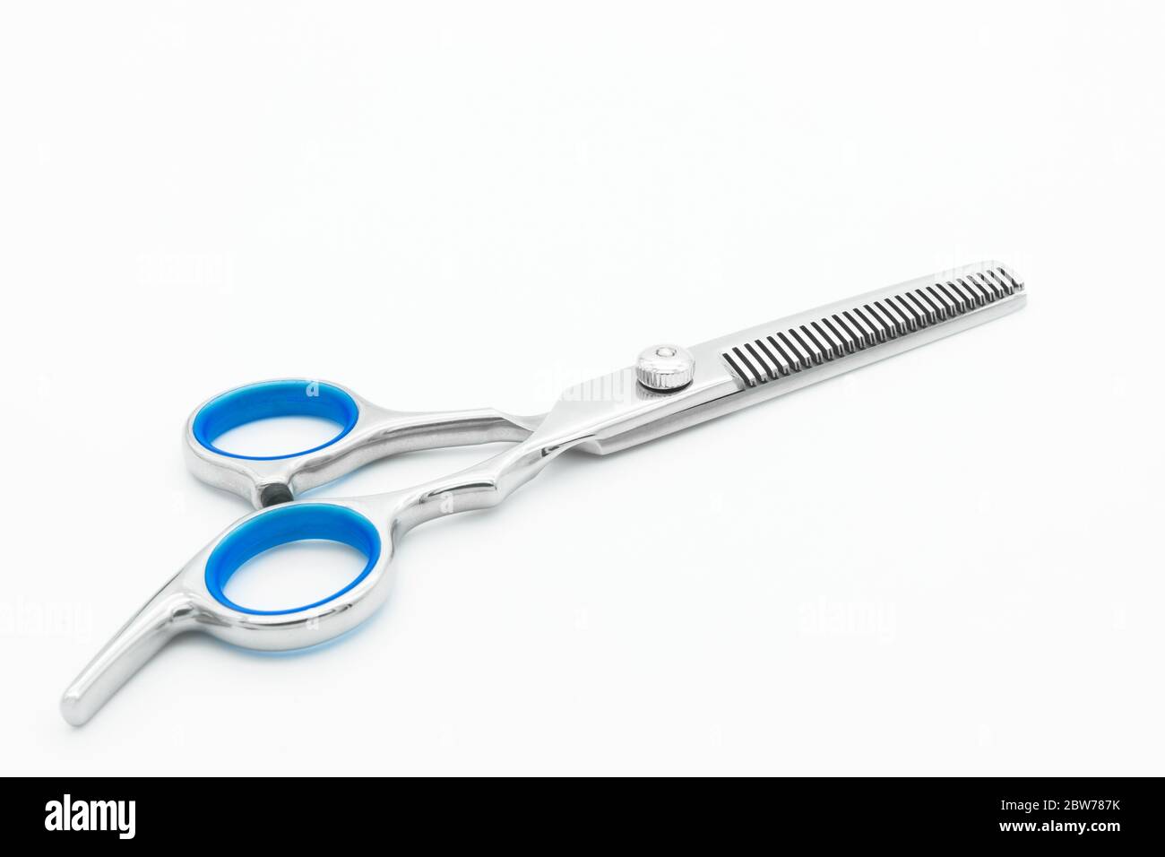 Close-up view of the teeth blade scissor isolated on white background ...