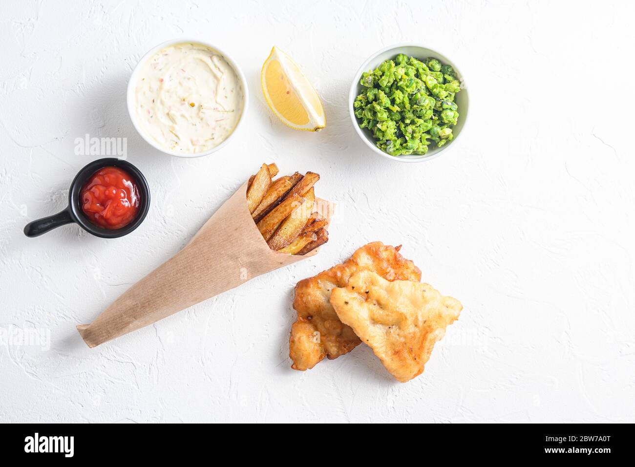 Components of traditional british set of fish and chips beer battered ...