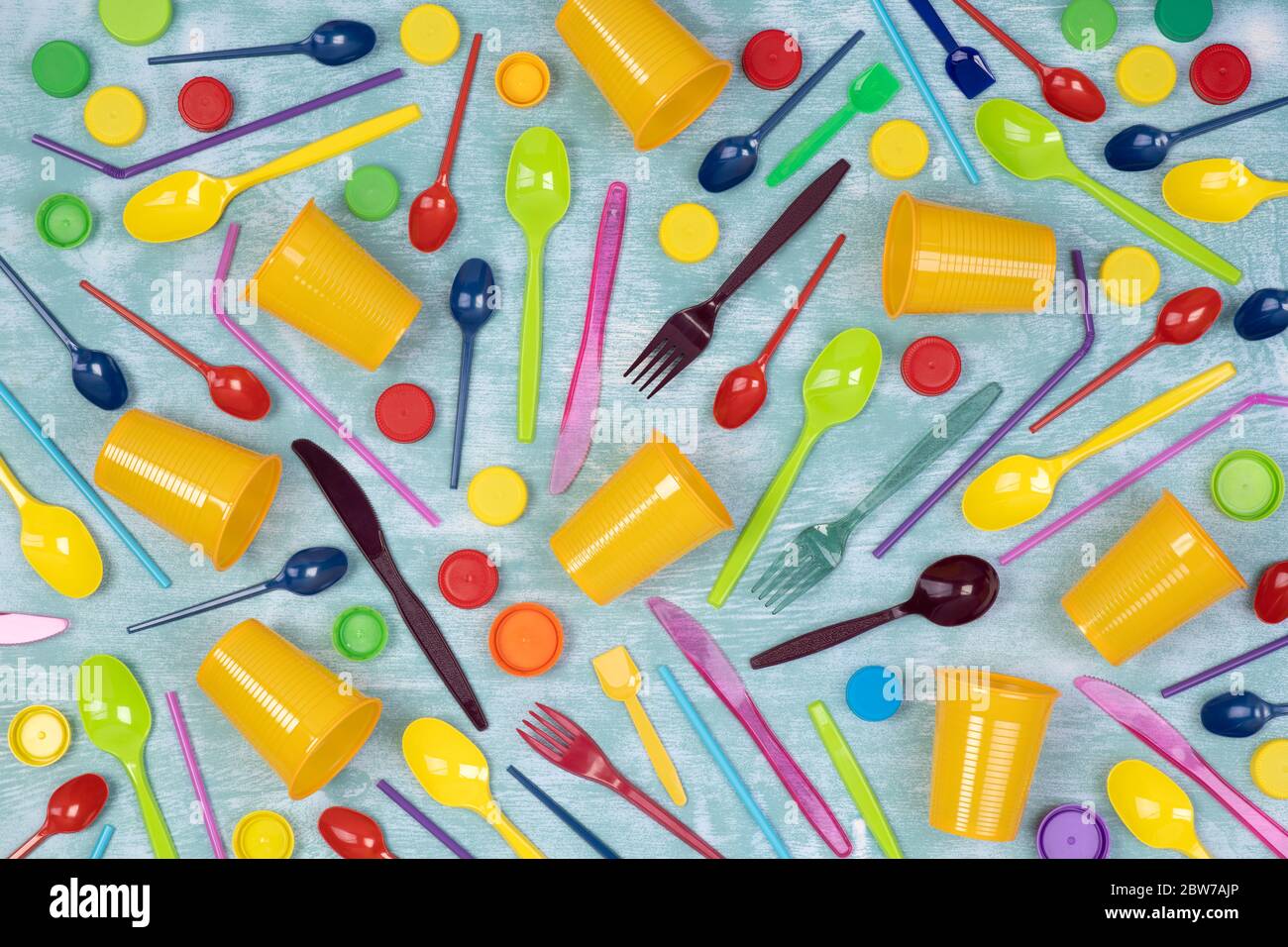 Disposable single use plastic objects such as cups, forks and spoons ...