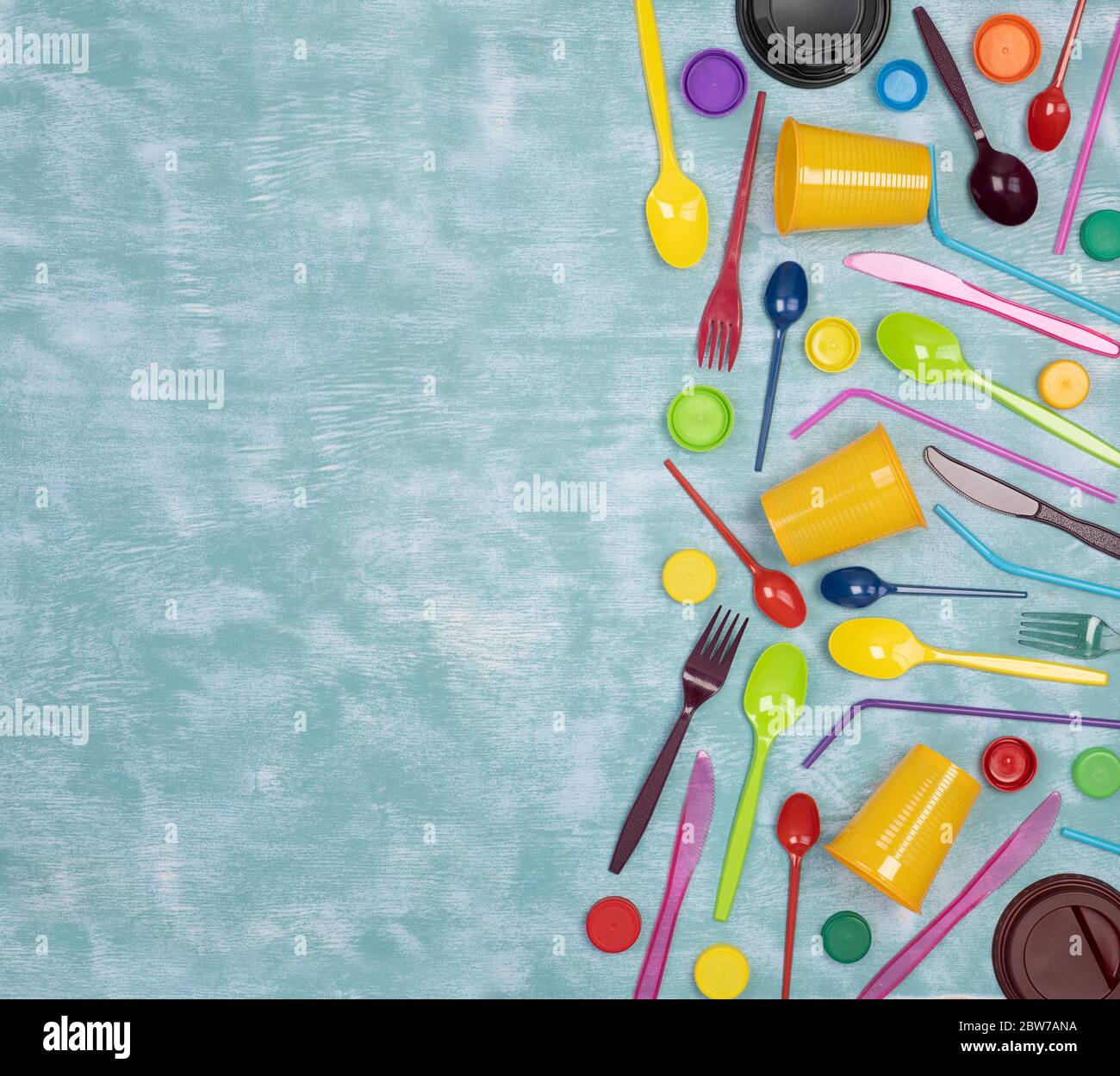 Disposable single use plastic objects such as cups, forks and spoons ...