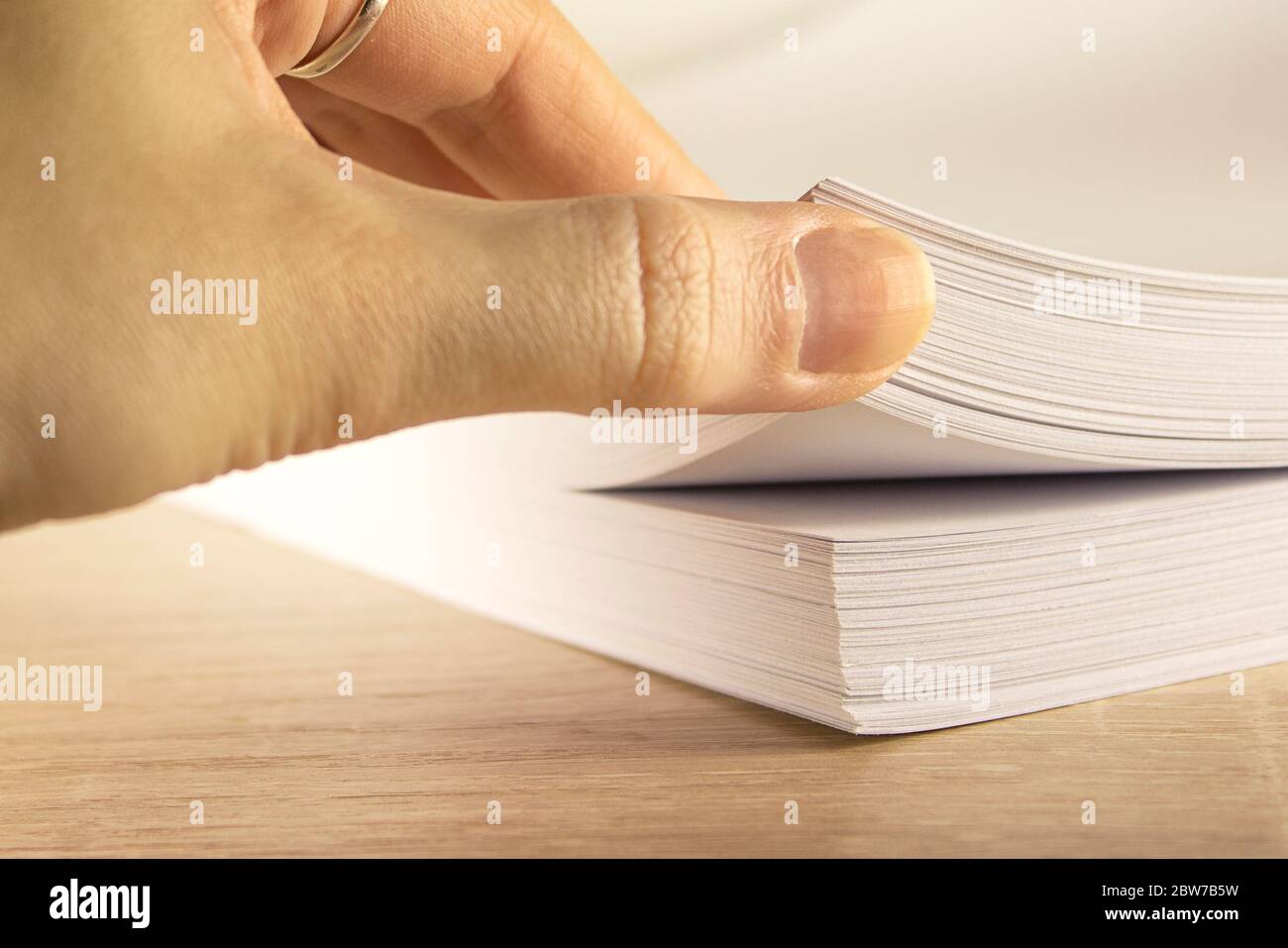 Stack of paper on office desk for report papers . Close up of stack ...