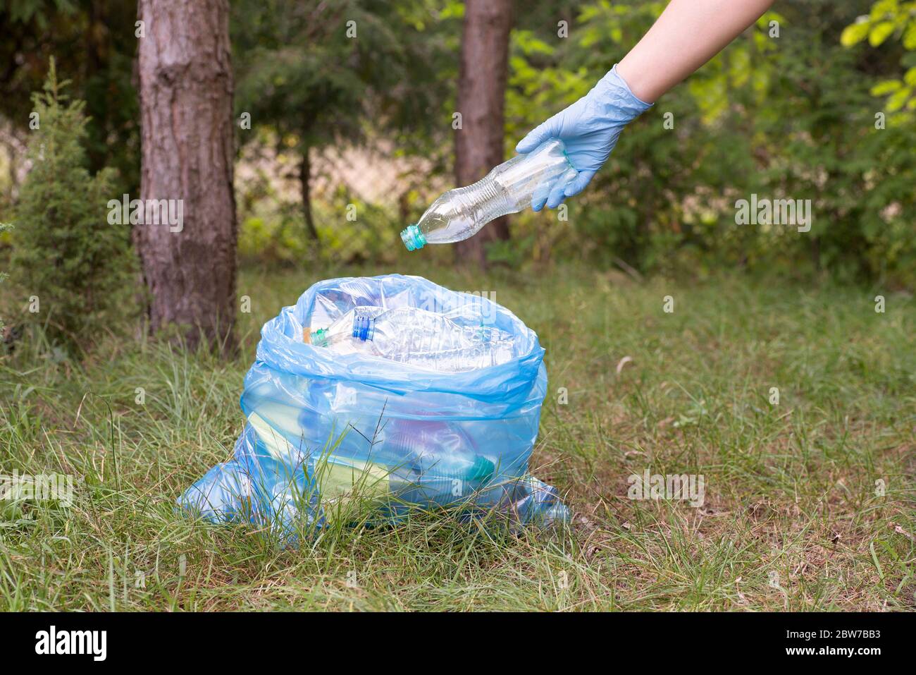Woman full trash bin hi-res stock photography and images - Alamy