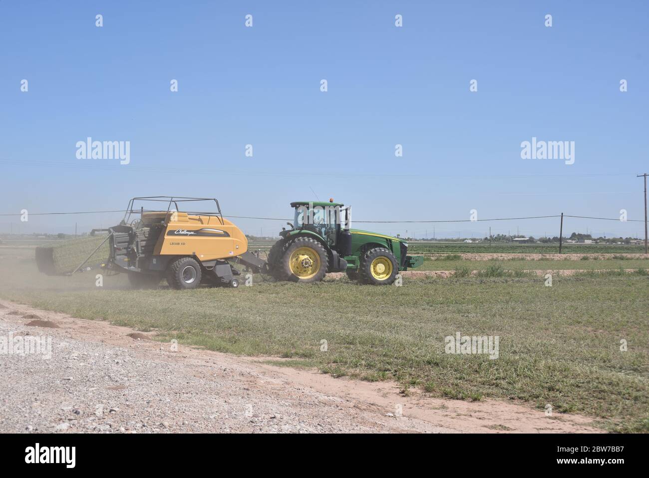 Glendale, AZ. U.S.A. April 23, 2020. John Deere 8235R tractor pulling a ...