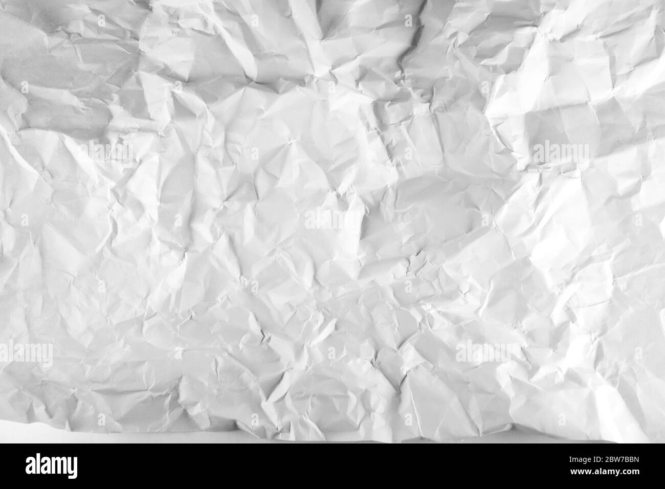 Top view closeup sheet of white crumpled uneven paper. Abstract modern ...