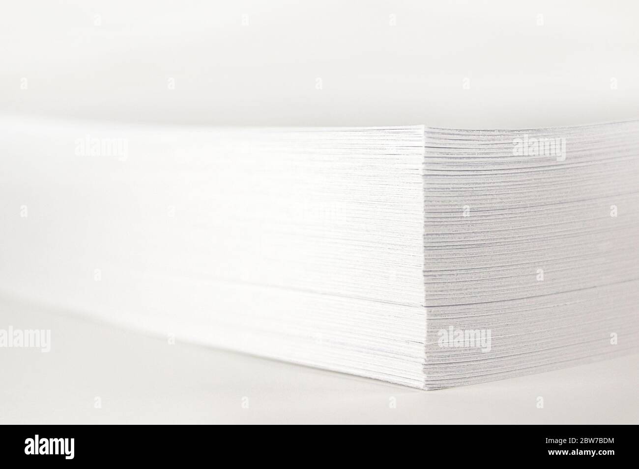 Close up of stack of papers on white background. Office: Pile of Paper ...