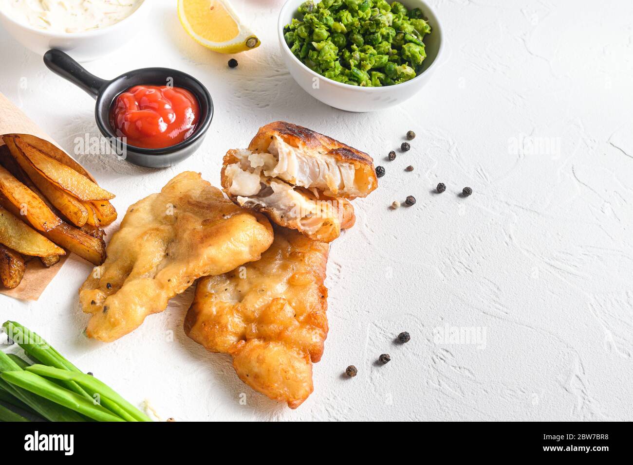 Fishand chips battered crispy cod fillet detail with dip and lemon in ...