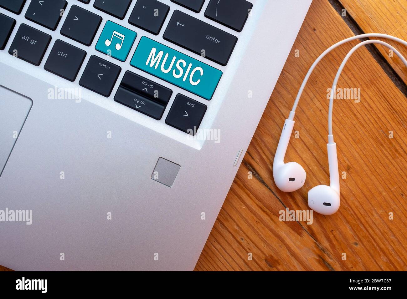 Laptop keyboard with colorful keys showing music notes Stock Photo - Alamy