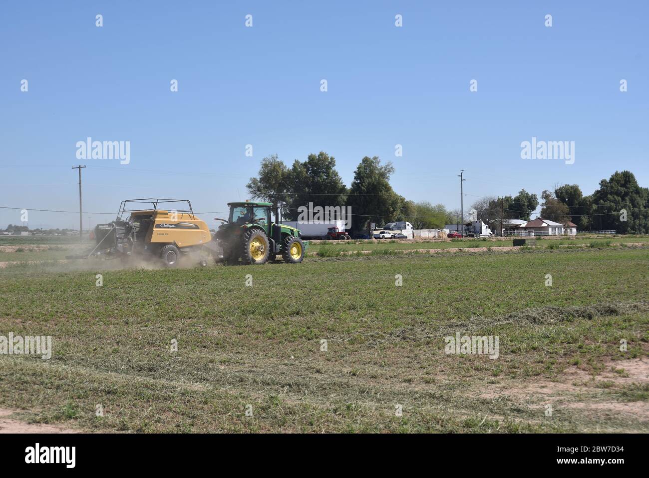 Glendale, AZ. U.S.A. April 23, 2020. John Deere 8235R tractor pulling a ...