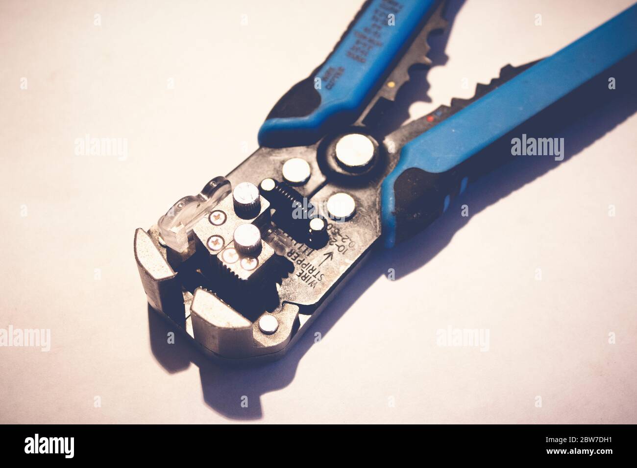 Professional blue wire strippers isolated on white background. Tool for ...