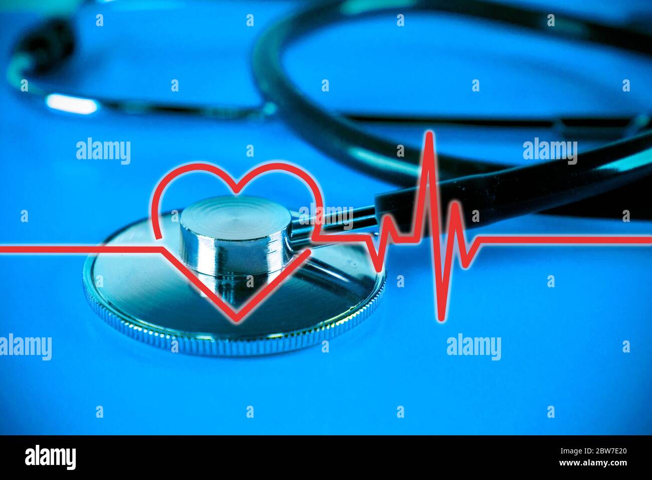 Heart sign, cardiogram, stethoscope on blue background with copy space ...