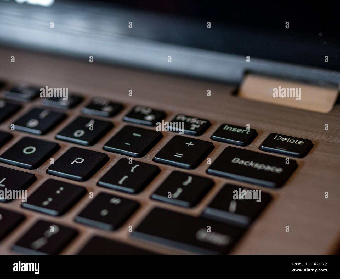 Closeup of laptop keyboard, Black keys on silver laptop. Delete key in ... Closeup of laptop keyboard, Black keys on silver laptop. Delete key in ...