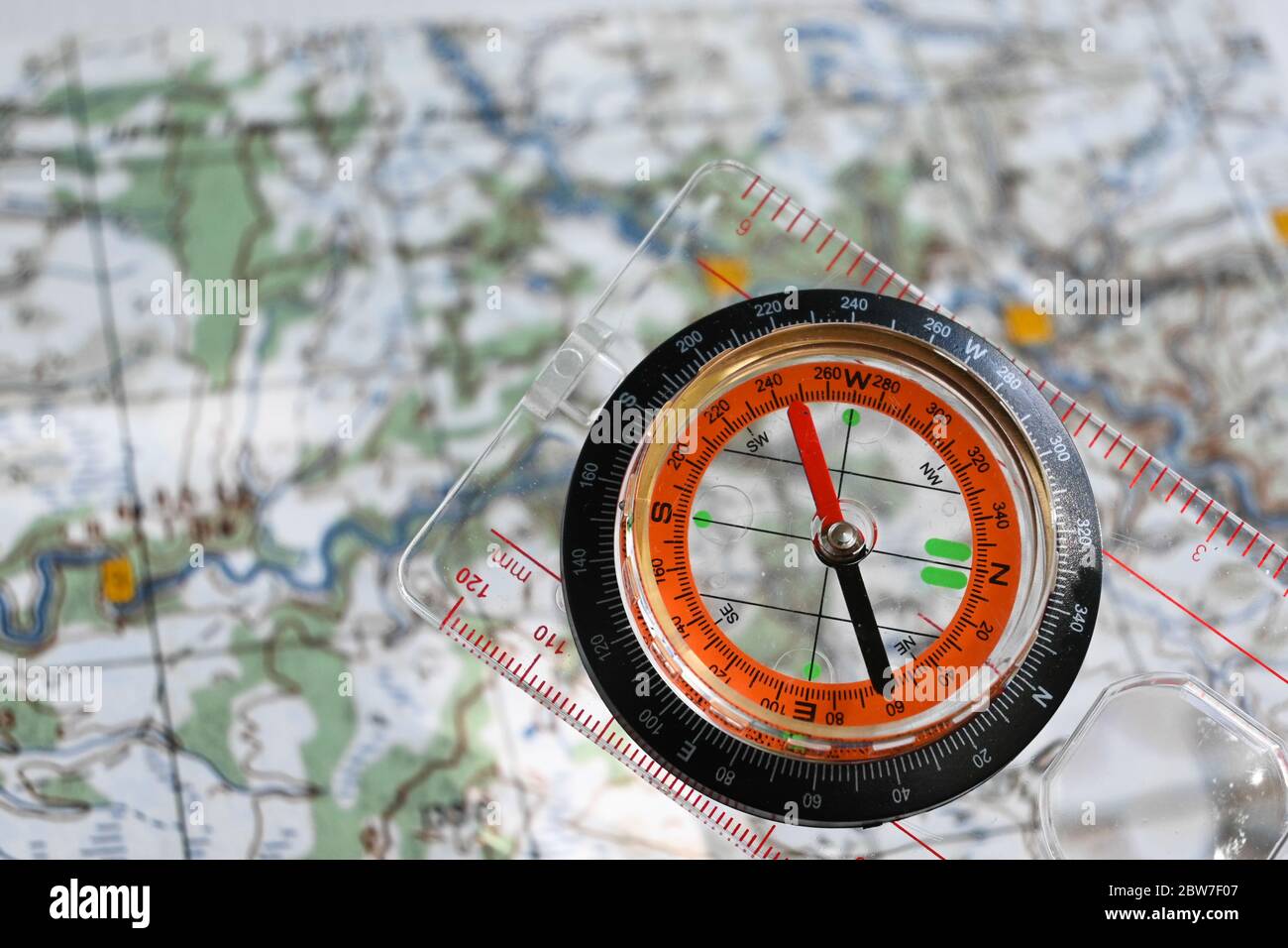 Going on a trip! Compass on the background of a topographic map Stock ...