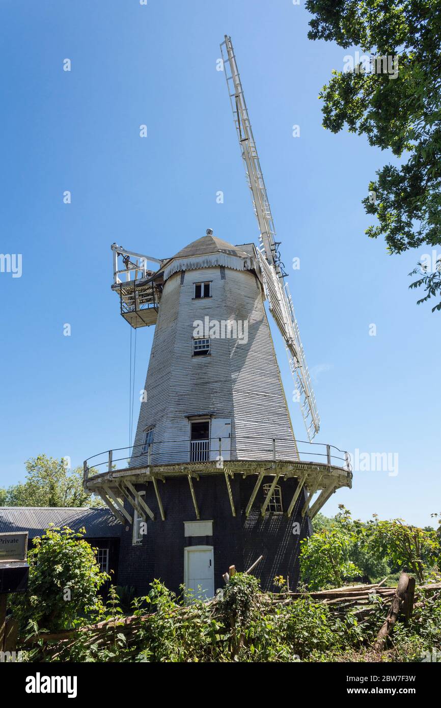 Old windmill 1879 at Shipley village near Horsham UK. White smock built ...