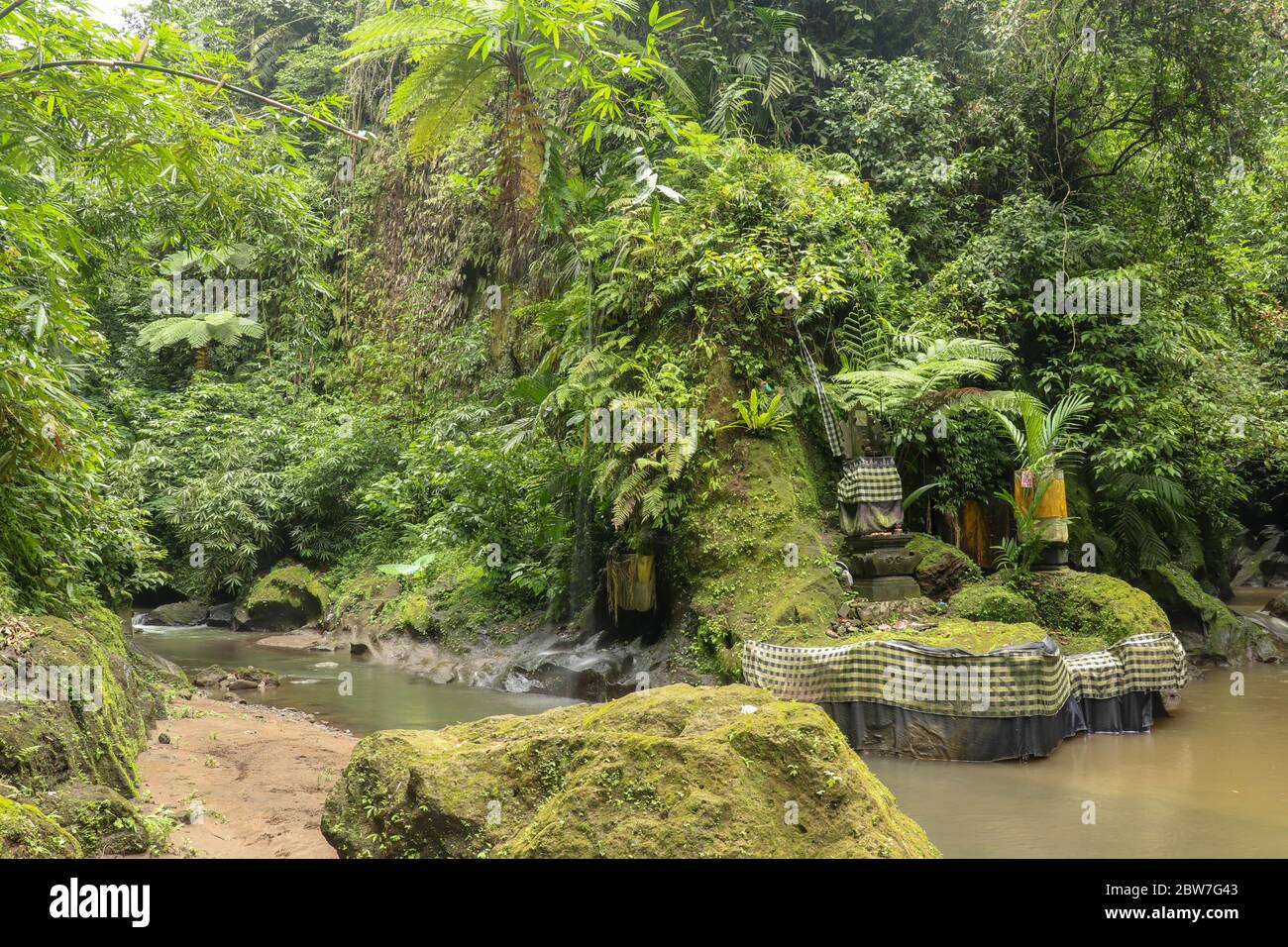 River and ancient hindu altar and Goa Giri temple in the forest Stock ...