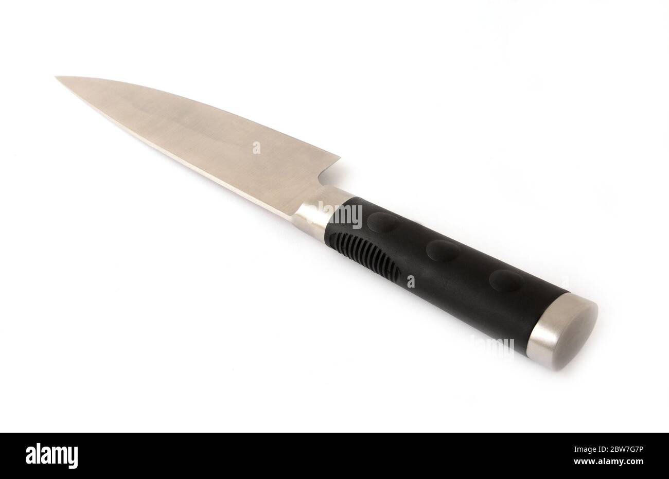 Sharp stainless steel chef knife with black handle over white ...