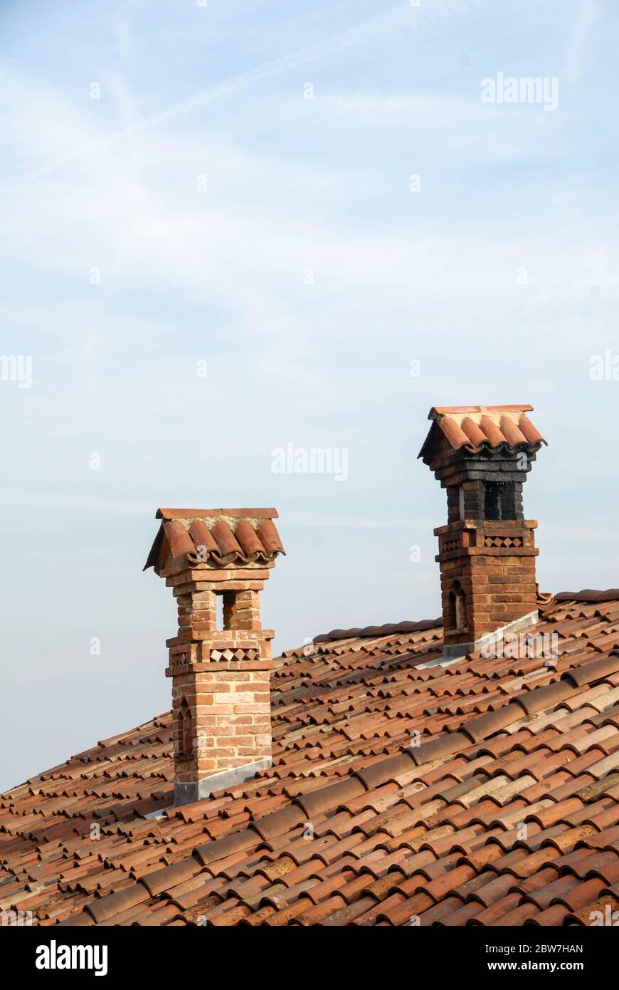 Two old chimneys on the roof with tiles Stock Photo - Alamy
