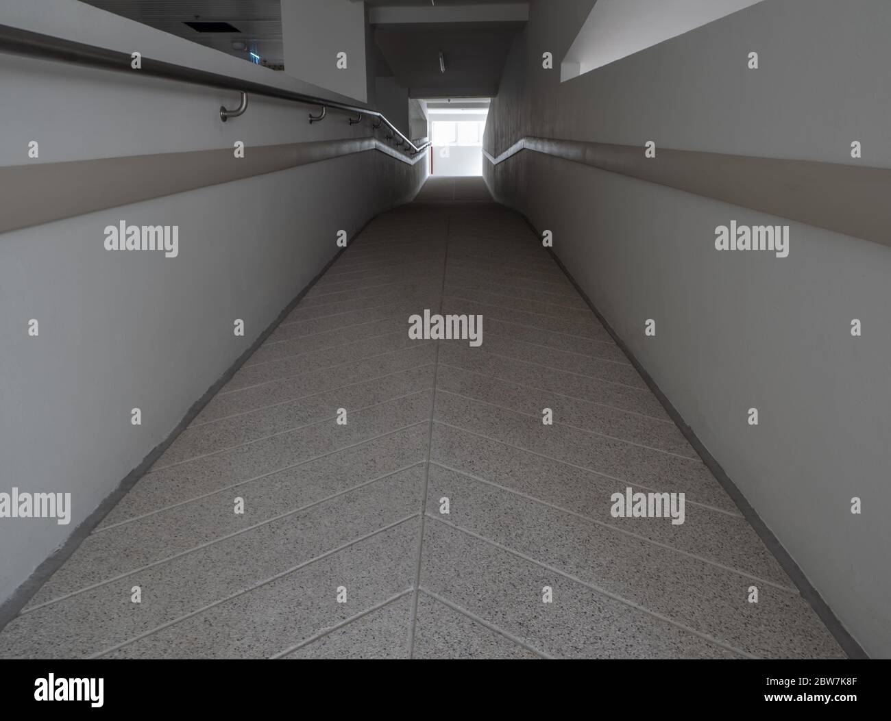 Light at the exit of the corridor in the building Stock Photo - Alamy