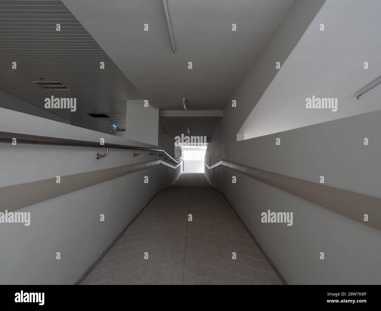 Light at the exit of the corridor in the building Stock Photo - Alamy