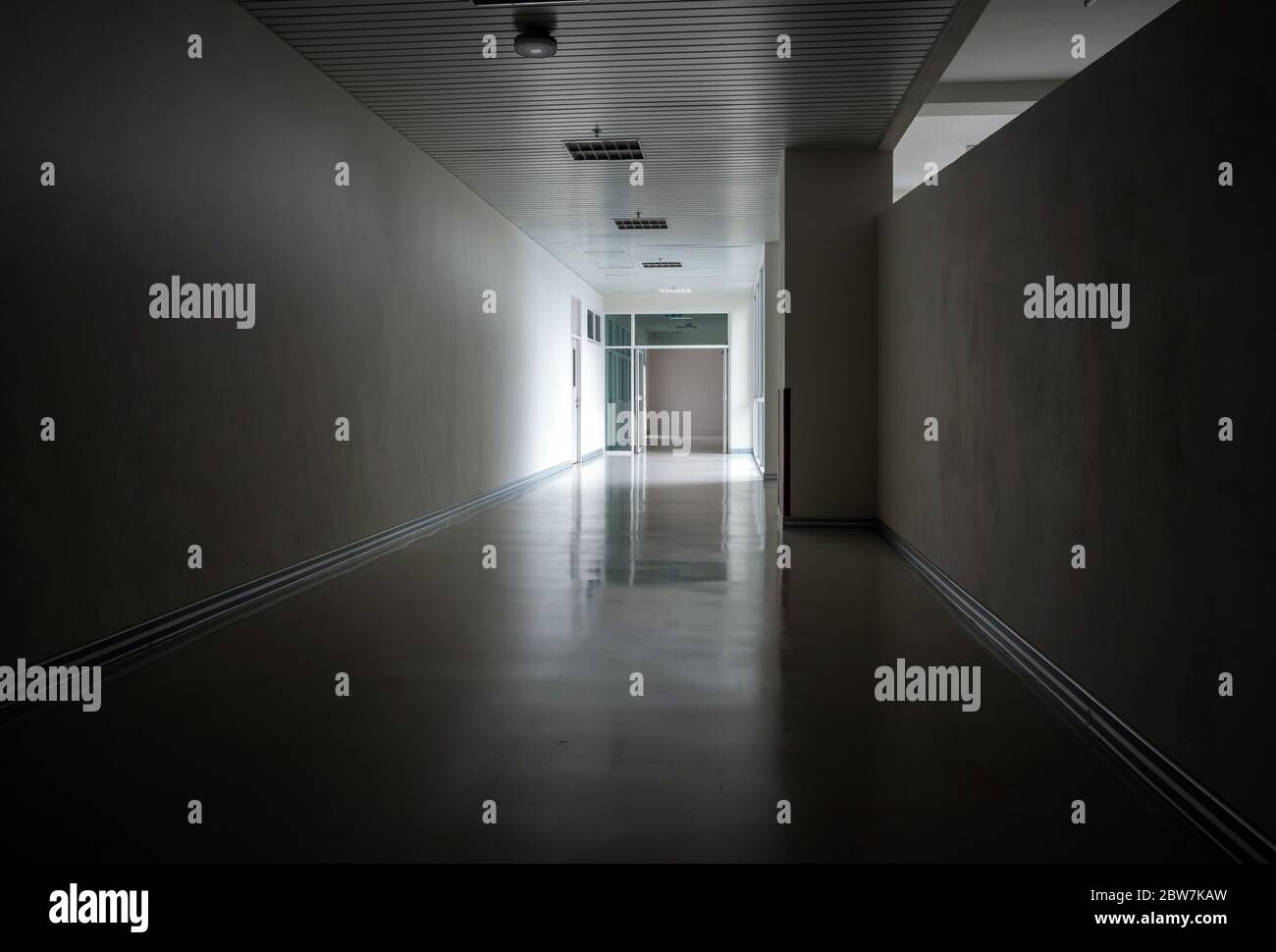 Light at the exit of the corridor in the building Stock Photo - Alamy