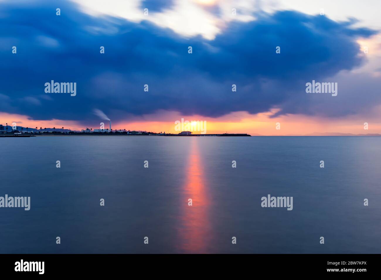 Sunset over the ocean in Osaka Bay with dramatic sky and clouds, Osaka ...
