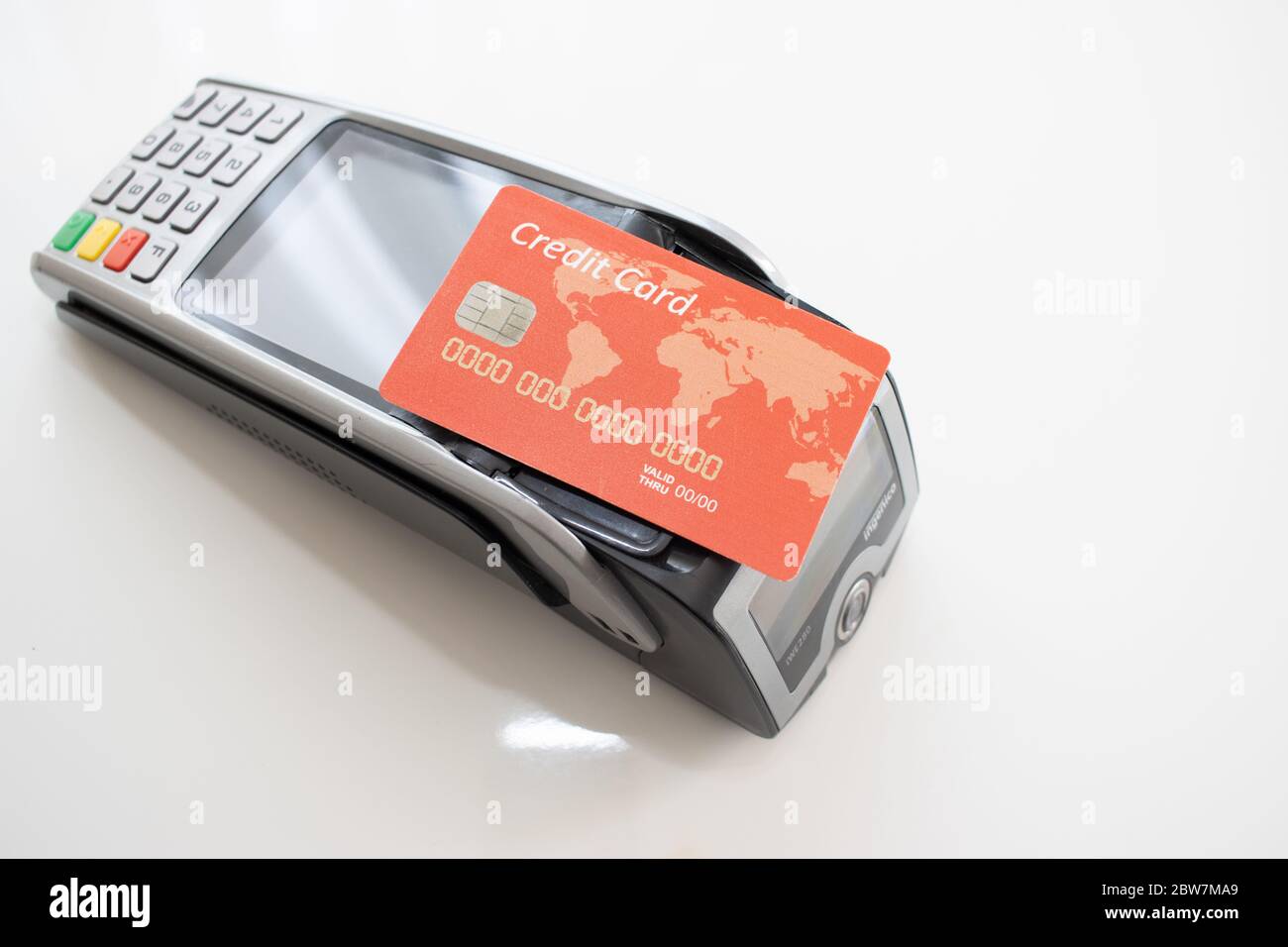 red Credit Card And Pos Terminal On White Stock Photo - Alamy