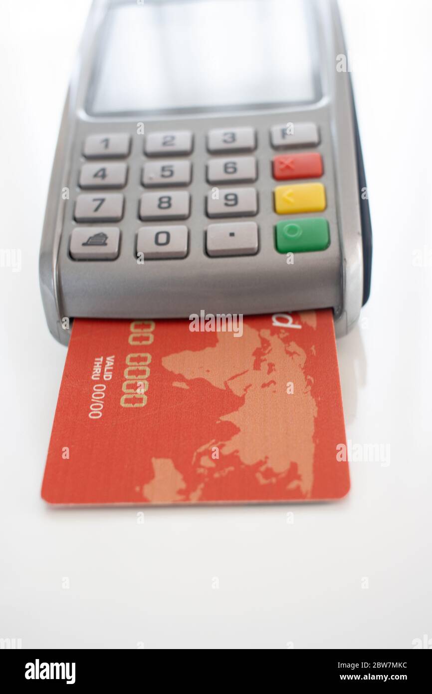 red Credit Card And Pos Terminal On White Stock Photo - Alamy