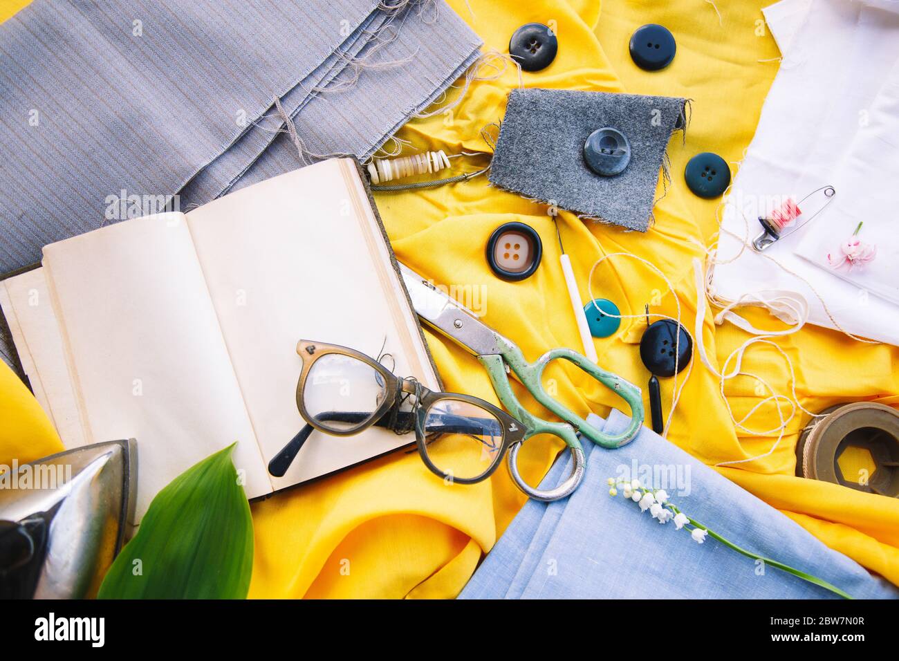 Creative sewing vintage old supplies on yellow cloth Stock Photo - Alamy