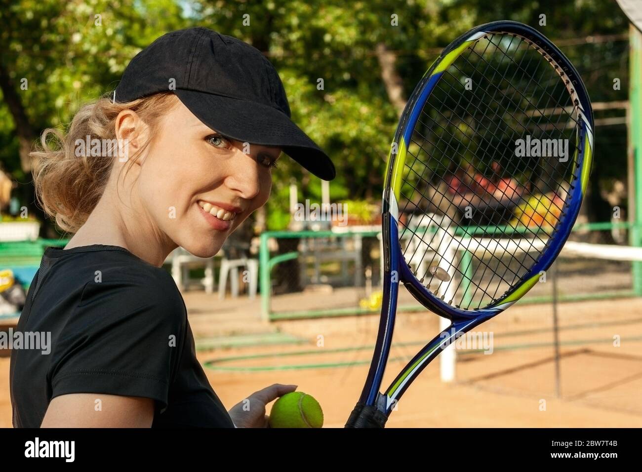Young girl athlete on the tennis court during training. Healthy ...