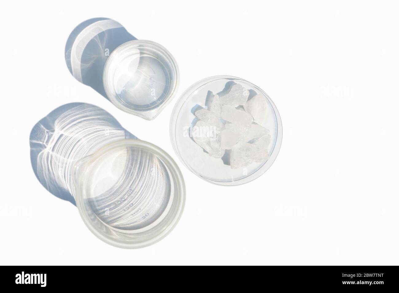 Closeup Alum Crystal in Chemical Watch Glass on white laboratory table ...