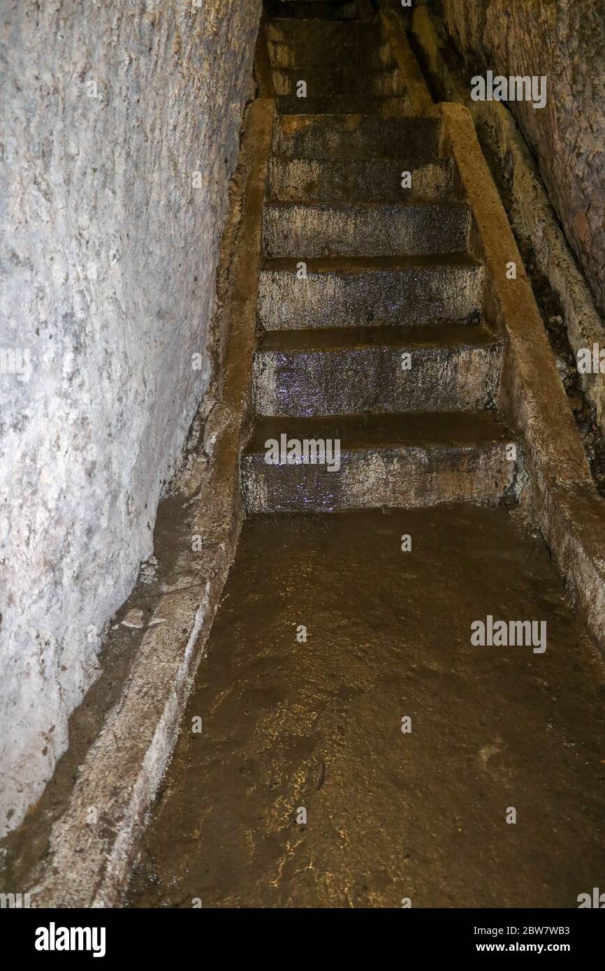 Access stairs to a cave. Stairs in a hand-carved tunnel into the Stock ...