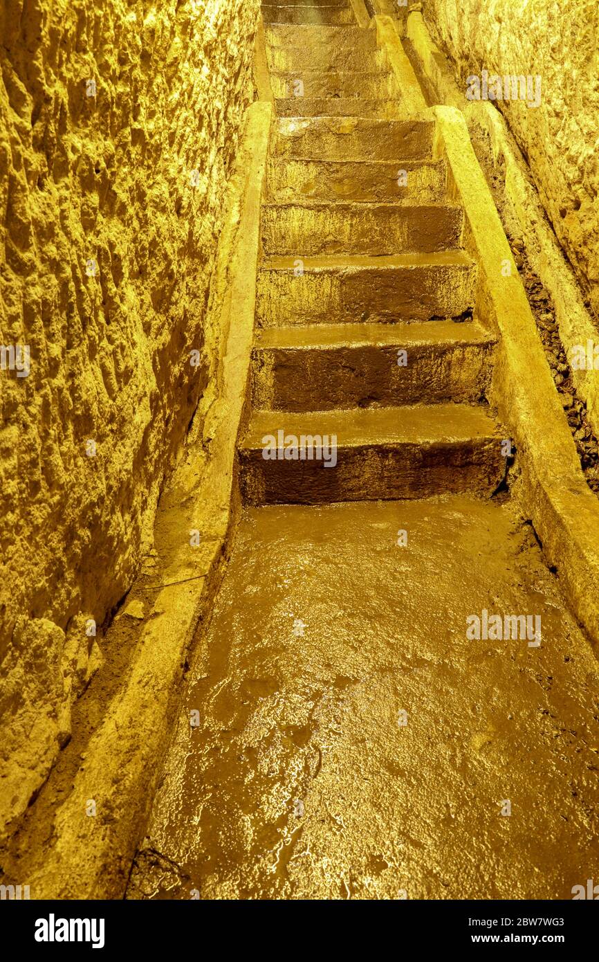 Access stairs to a cave. Stairs in a hand-carved tunnel into the Stock ...